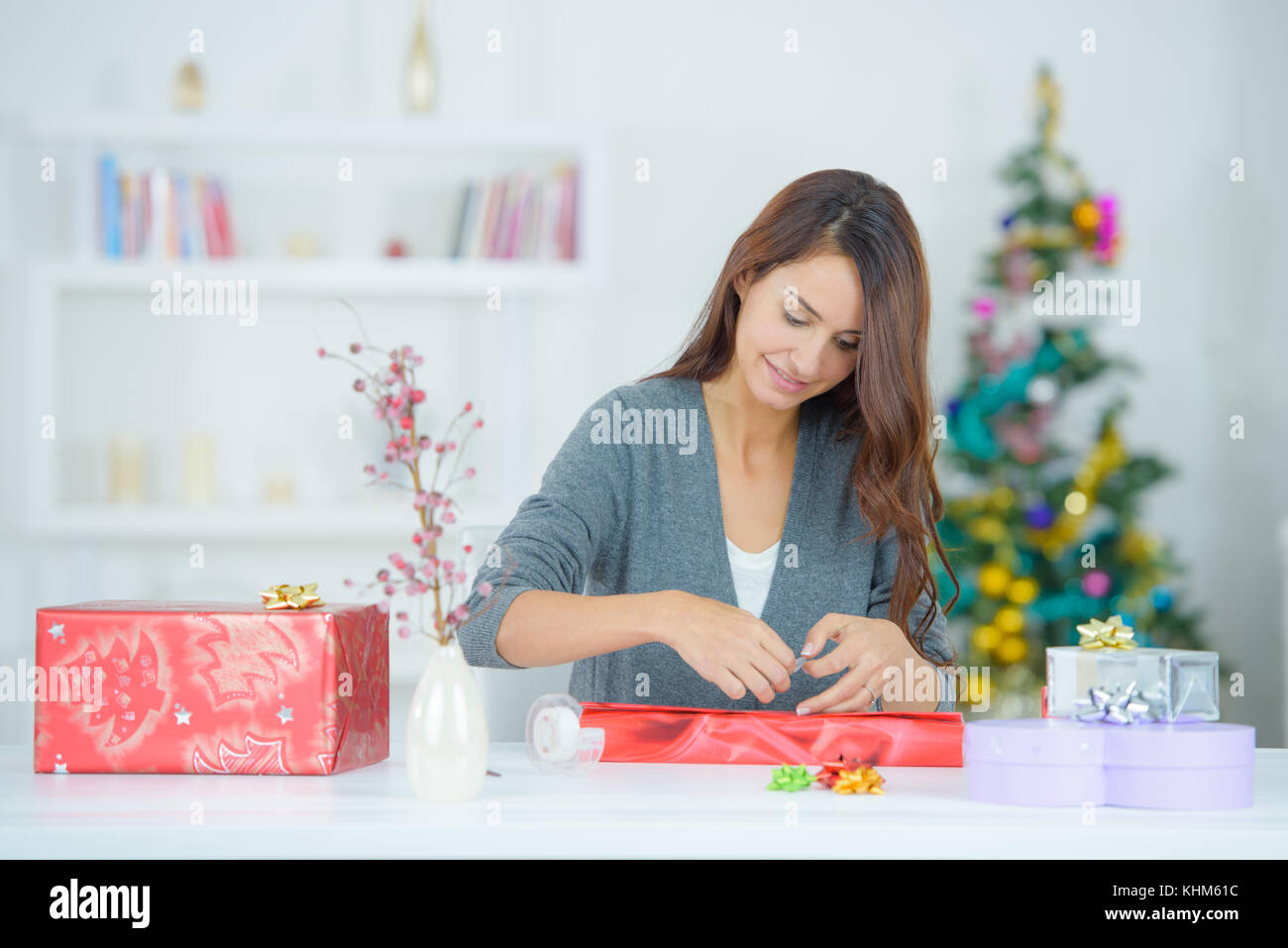 woman wrapping the gifts Stock Photo - Alamy
