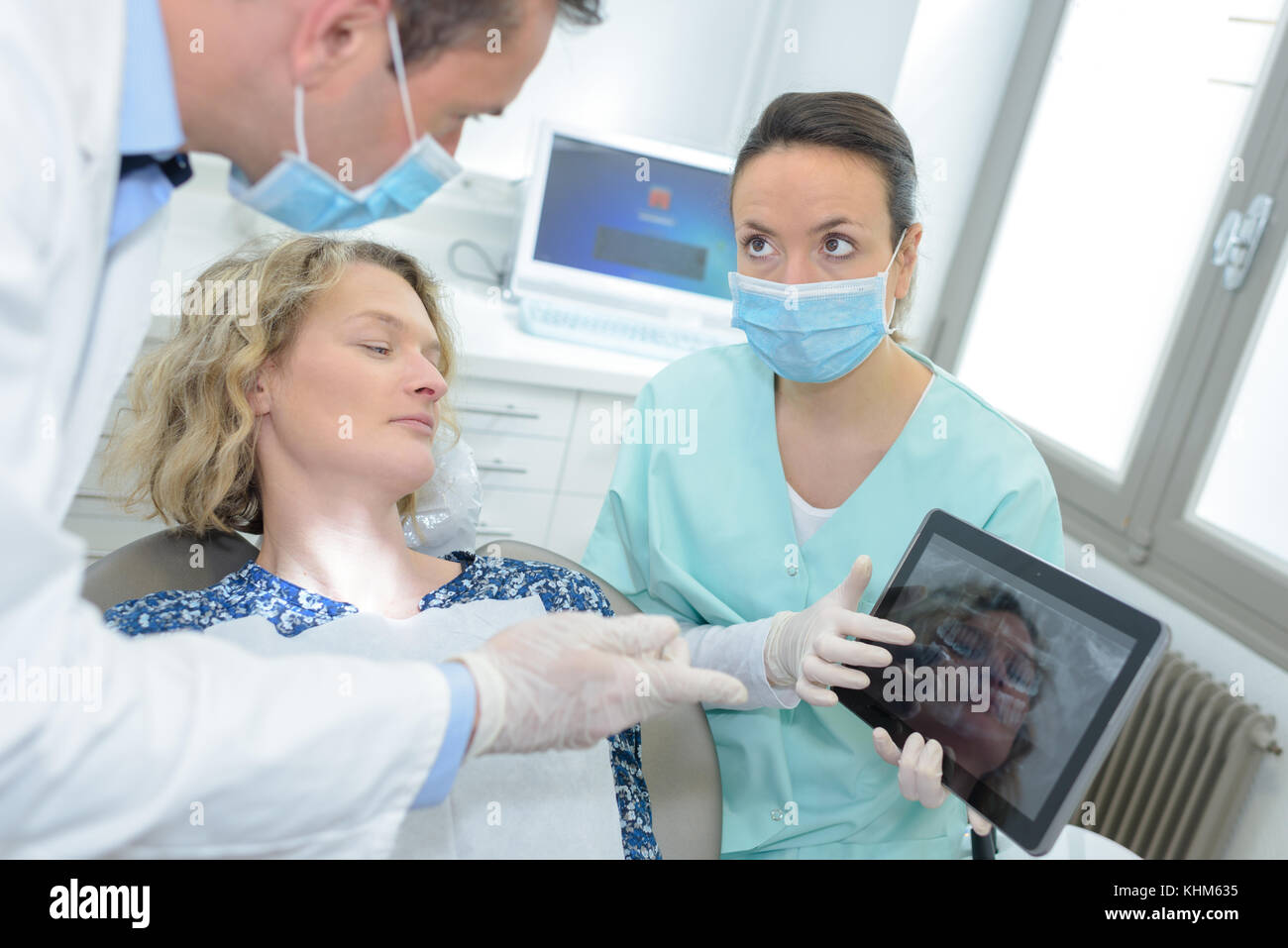 dentist with x-ray on tablet pc computer and girl patient Stock Photo ...