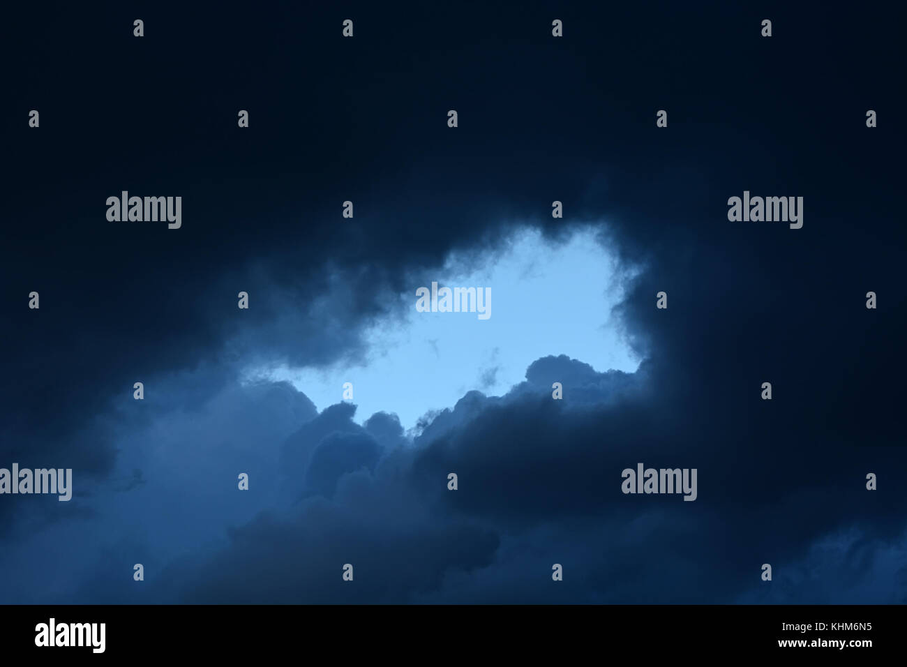 Stormy clouds and window with serene blue sky Stock Photo - Alamy