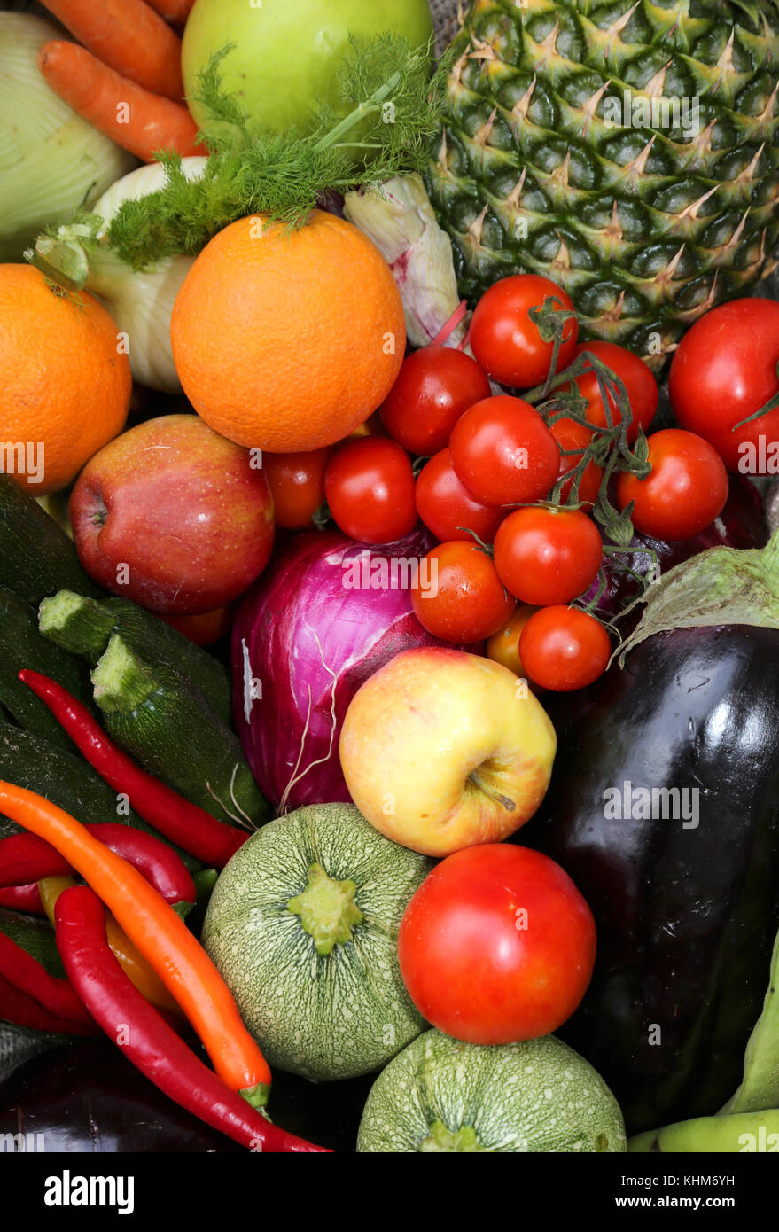background of fresh fruits and vegetables like pineaple,carrots and ...