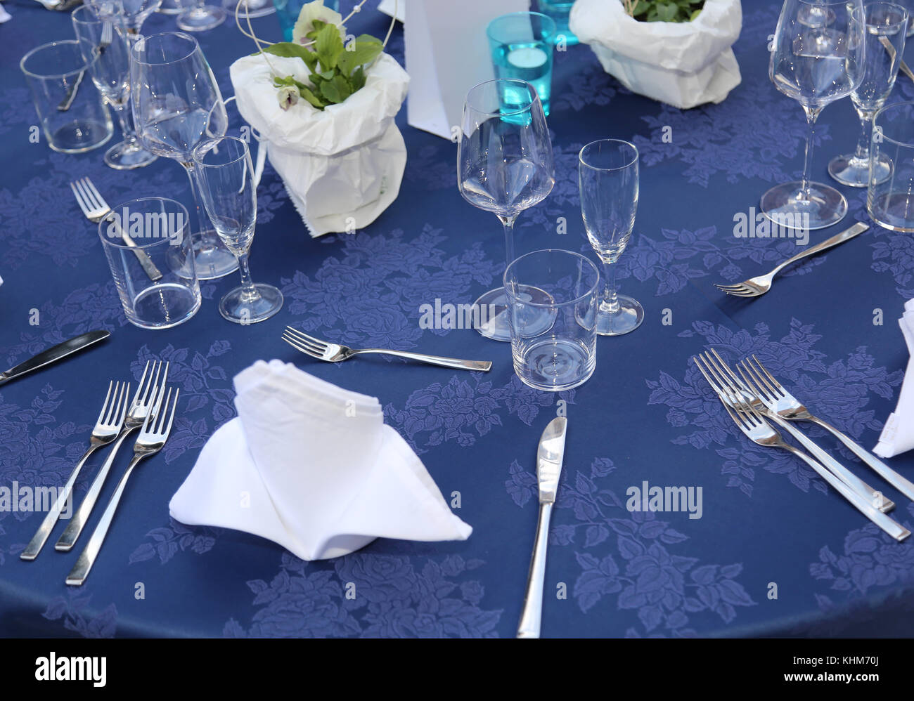 elegant table set before the official lunch with white dish and table ...
