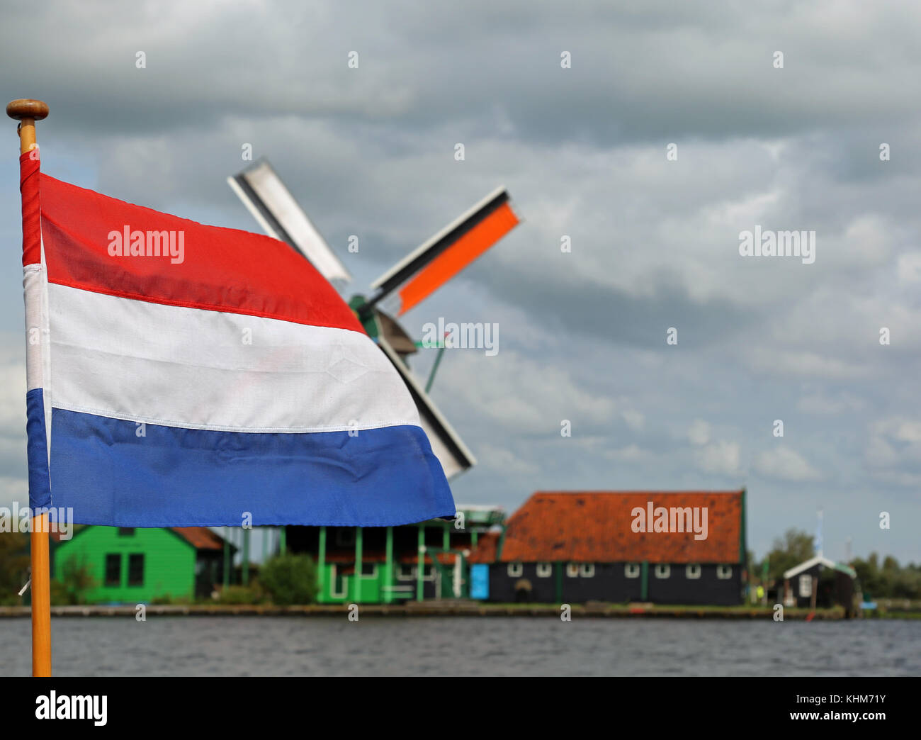 Big Dutch flags and in the background the windmill Stock Photo - Alamy