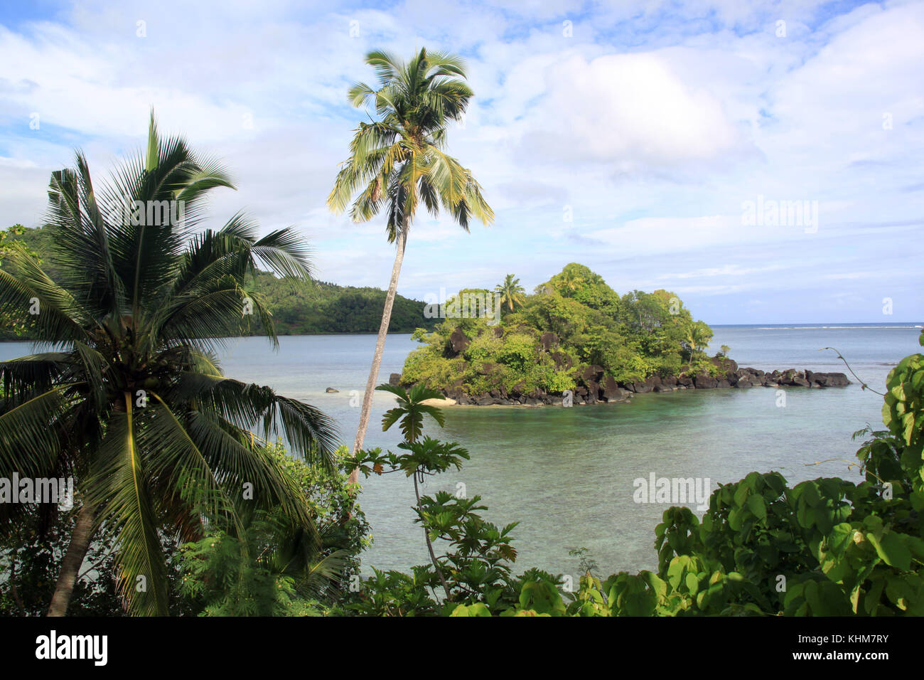 Bay with island and palm trees on the coast in Upolu, Samoa Stock Photo ...