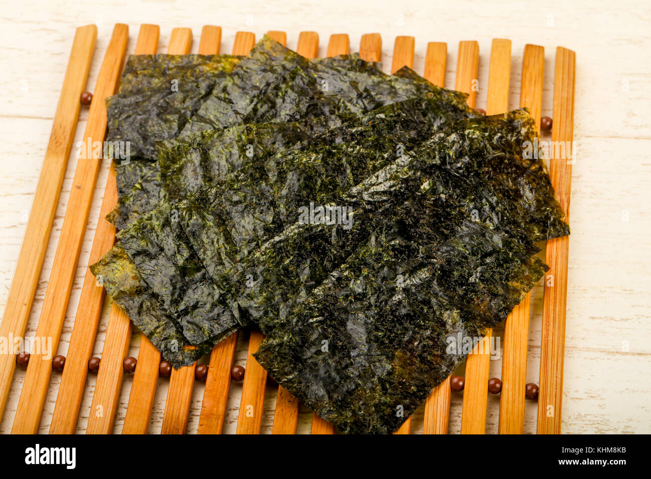 Crispy Nori sheets chips over wooden background Stock Photo - Alamy