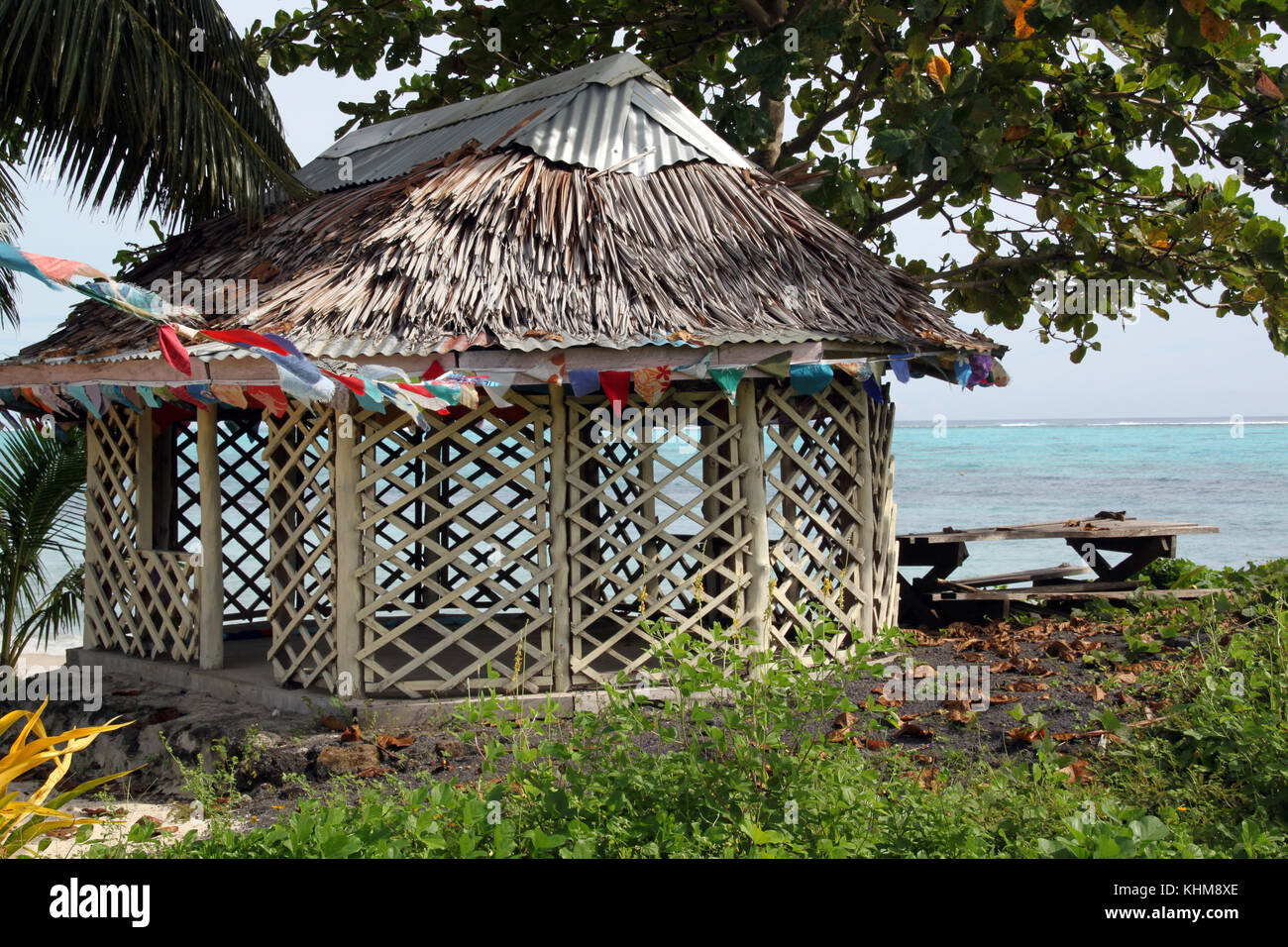 Hut with flags under tree on the beach in Savaii island, Samoa Stock ...