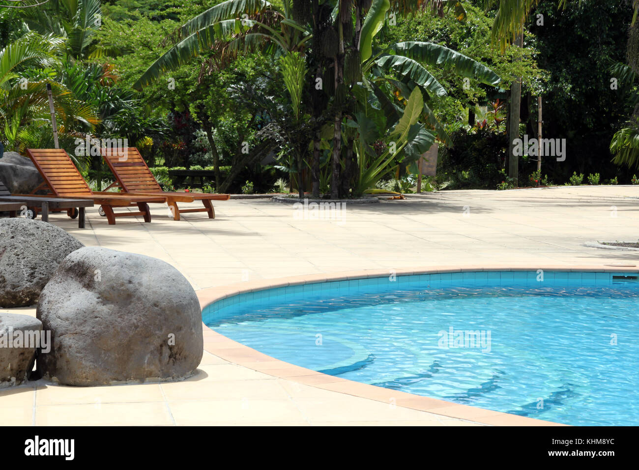 Rocks, pool with steps and water in the inner yard of hotel in Savaii ...