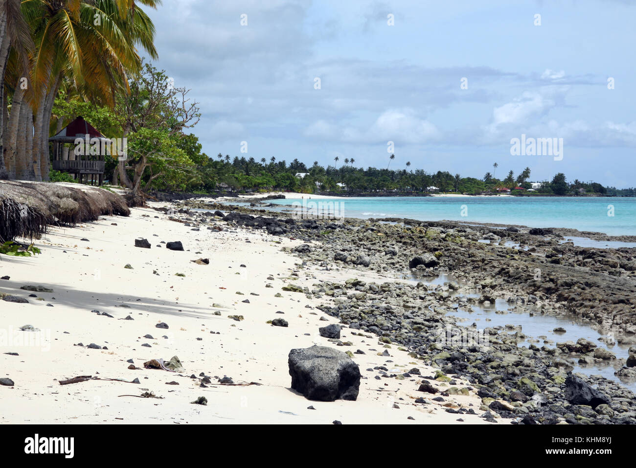 Sand beach, hut and pulm trees on the Savaii island in Samoa Stock ...
