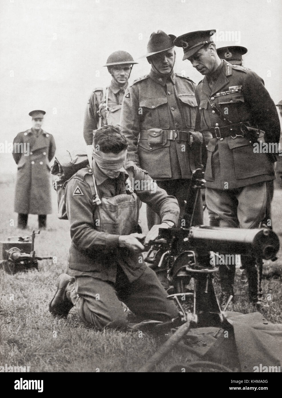 King George VI watching a blindfolded Australian soldier assemble a ...