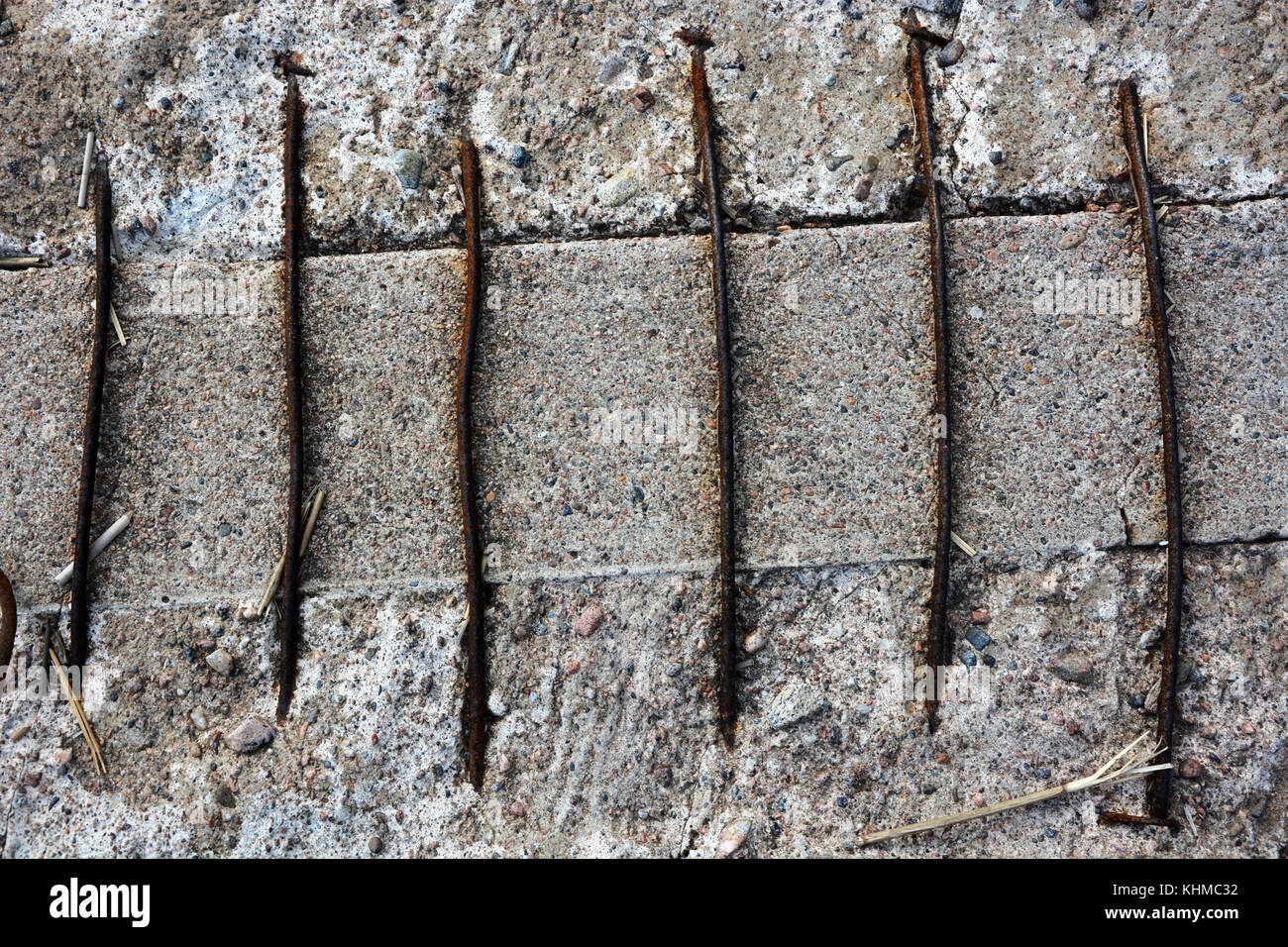 Grunge concrete wall with rusty armature. Picture can be used as a ...