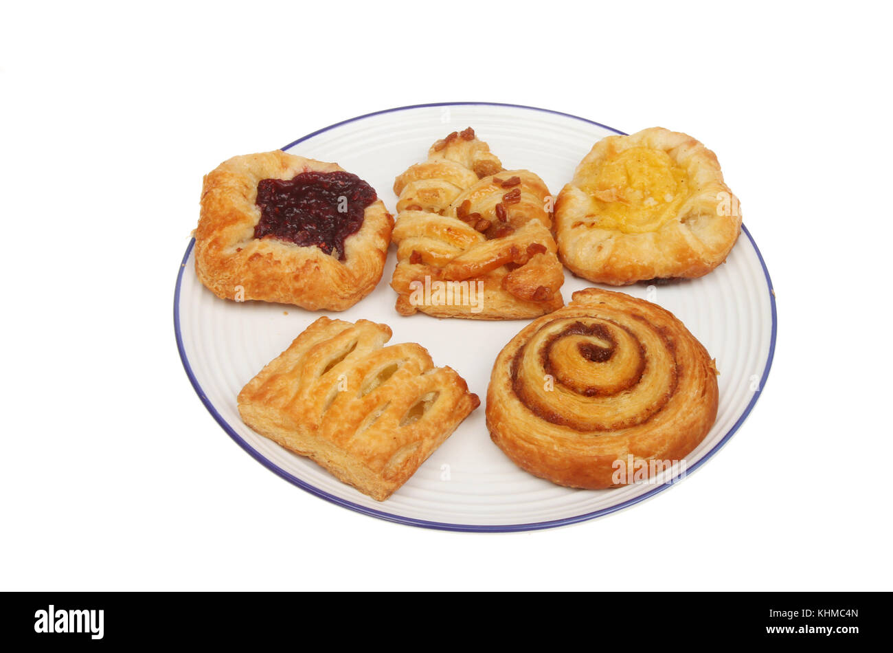 Mini Danish pastries on a plate isolated against white Stock Photo - Alamy
