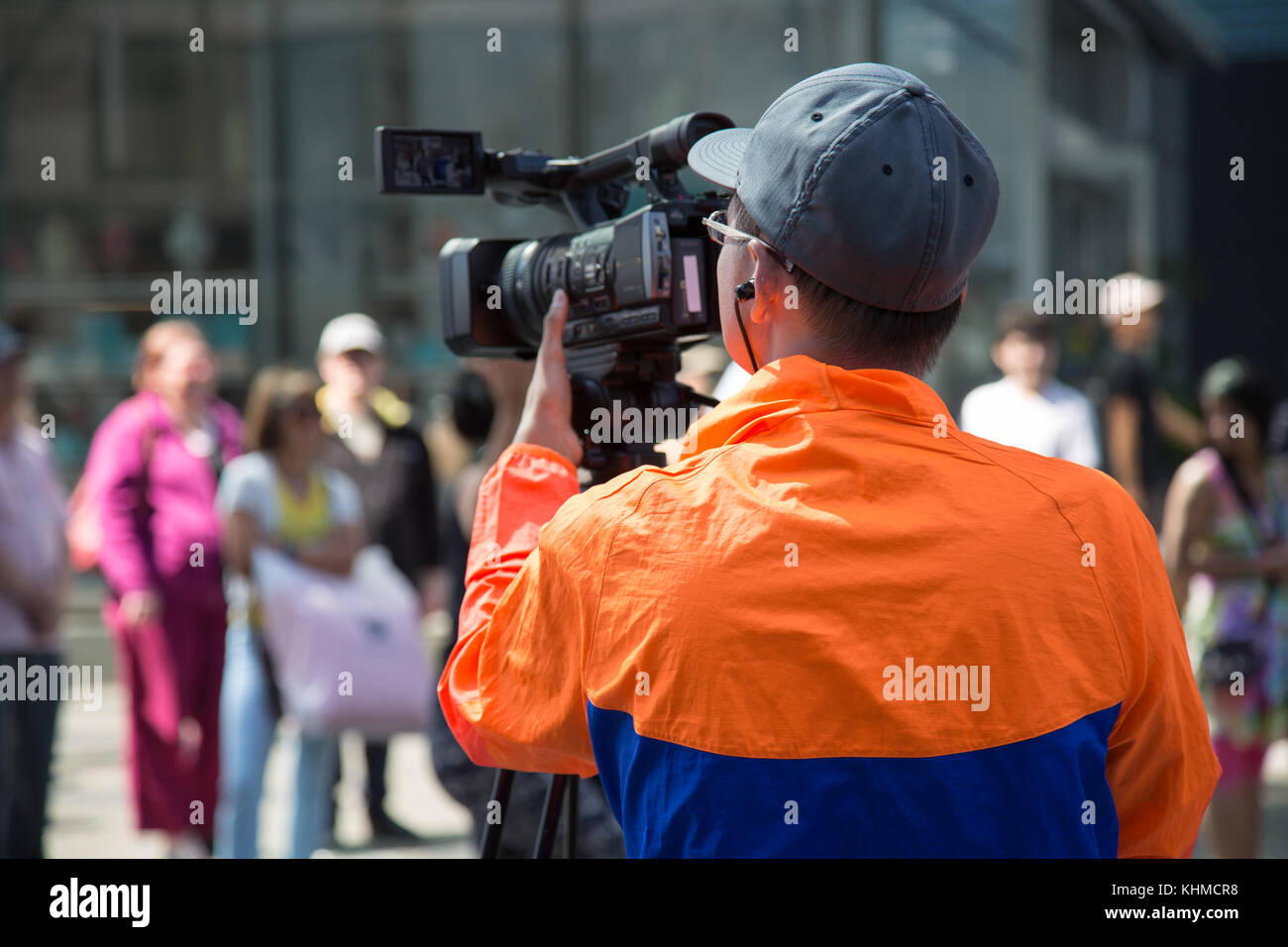 Cameraman filming urban street event recording broadcasting Stock Photo ...