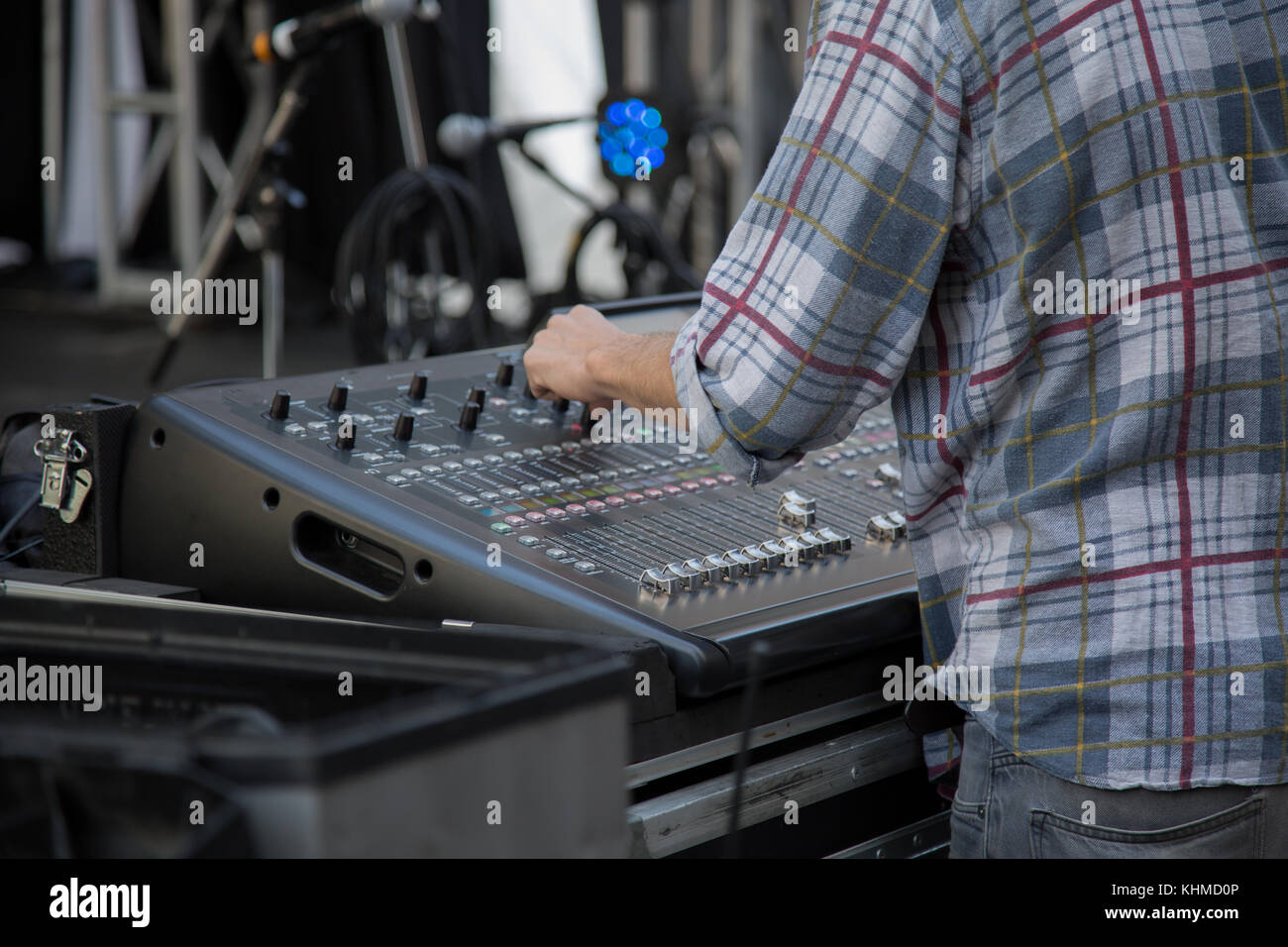 Music panel equipment switches hand close up background Stock Photo - Alamy