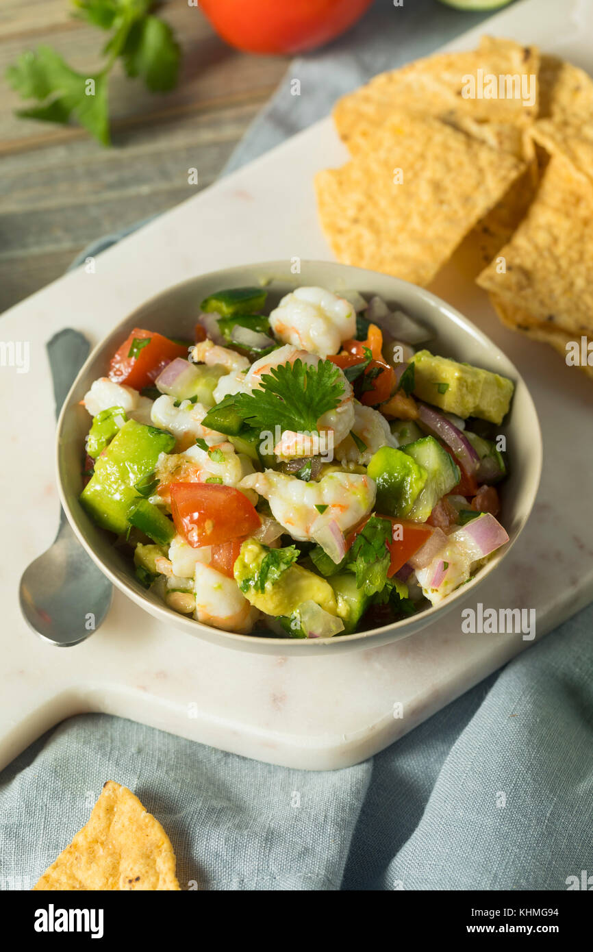Raw Homemade Shrimp Ceviche with Veggies and Chips Stock Photo - Alamy