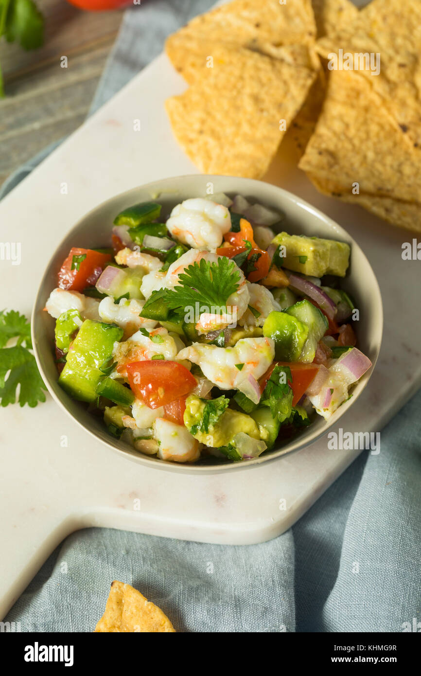 Raw Homemade Shrimp Ceviche with Veggies and Chips Stock Photo - Alamy