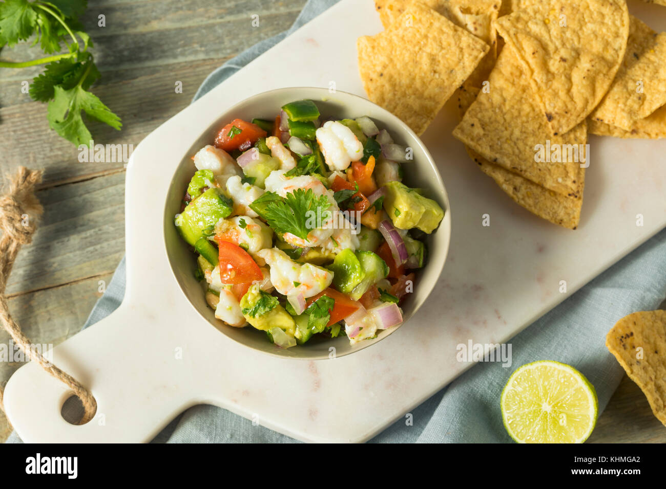 Raw Homemade Shrimp Ceviche with Veggies and Chips Stock Photo - Alamy