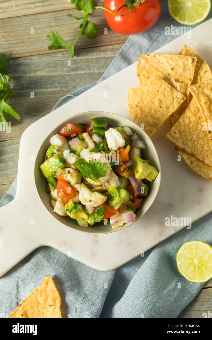 Raw Homemade Shrimp Ceviche with Veggies and Chips Stock Photo - Alamy