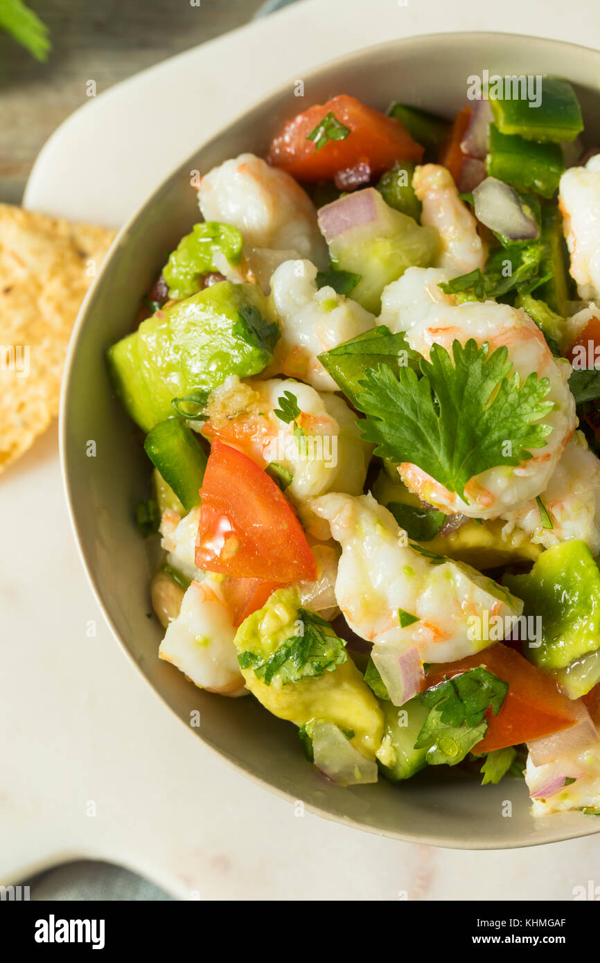 Raw Homemade Shrimp Ceviche with Veggies and Chips Stock Photo - Alamy