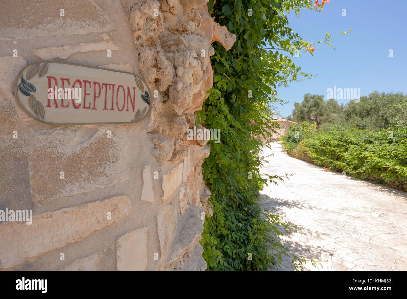 reception sign on a stone wall at the entrance of building in the ...
