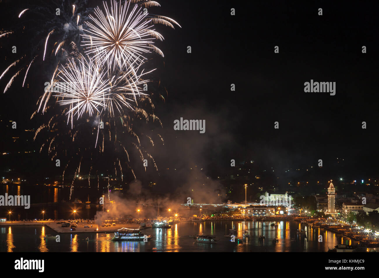 Greek island celebration with fireworks in the night sky Stock Photo ...