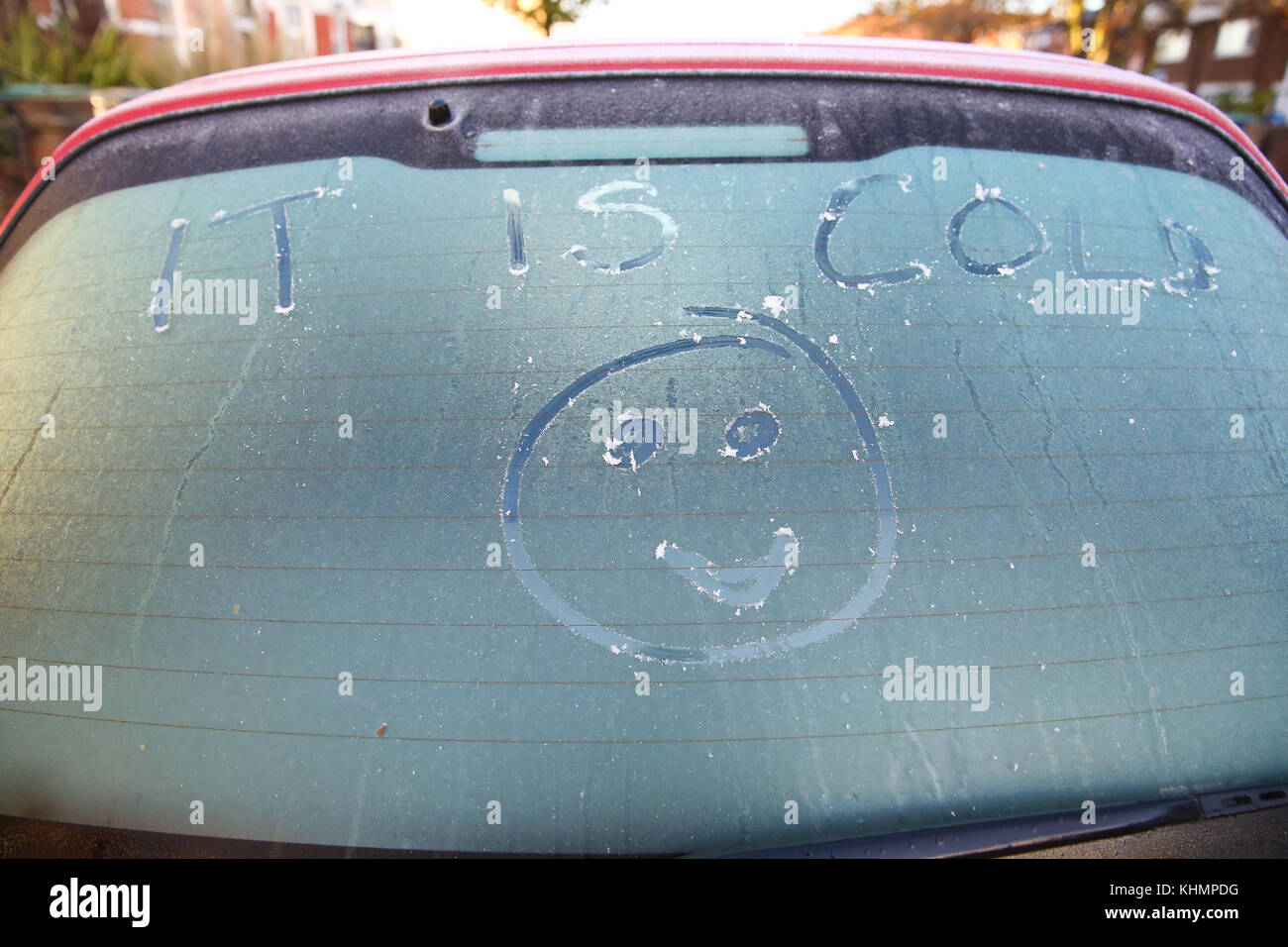 Smiley face on an icy car windscreen hi-res stock photography and ...