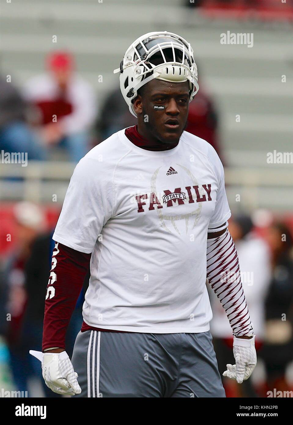 Nov 18, 2017: Bulldog defensive tackle Cory Thomas #34 lifts up his helmet as he warms up before ...