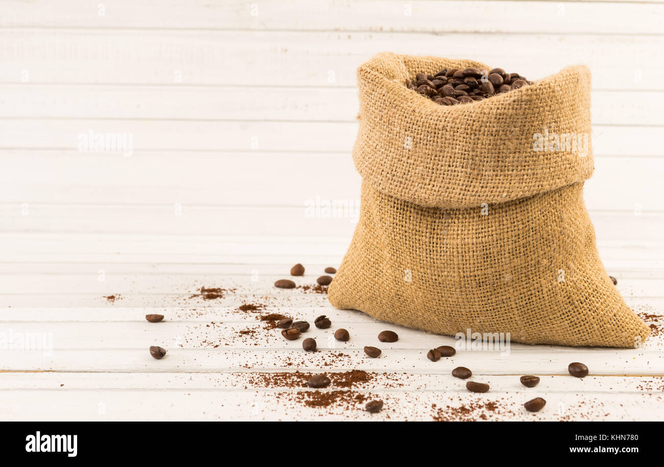 Jute coffee bag sack on white wood background with copy space or text ...