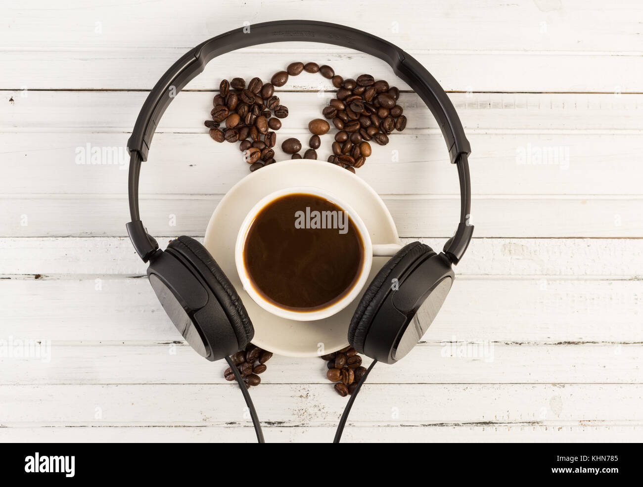 Morning coffee and music concept with headphones and cup on white ...