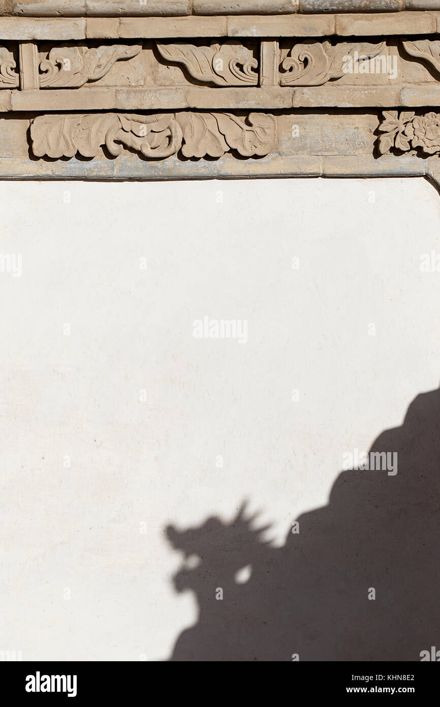 shadow of dragon on chinese wall Stock Photo - Alamy