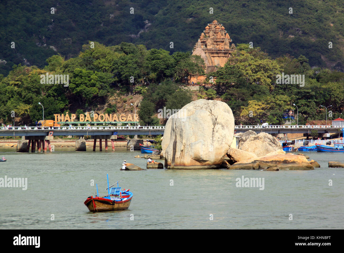 Boat, bridge and old cham tower in Nha Trang, Vietnam Stock Photo - Alamy