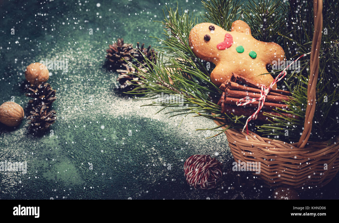 gingerbread man and coniferous branches in basket, banner format Stock ...