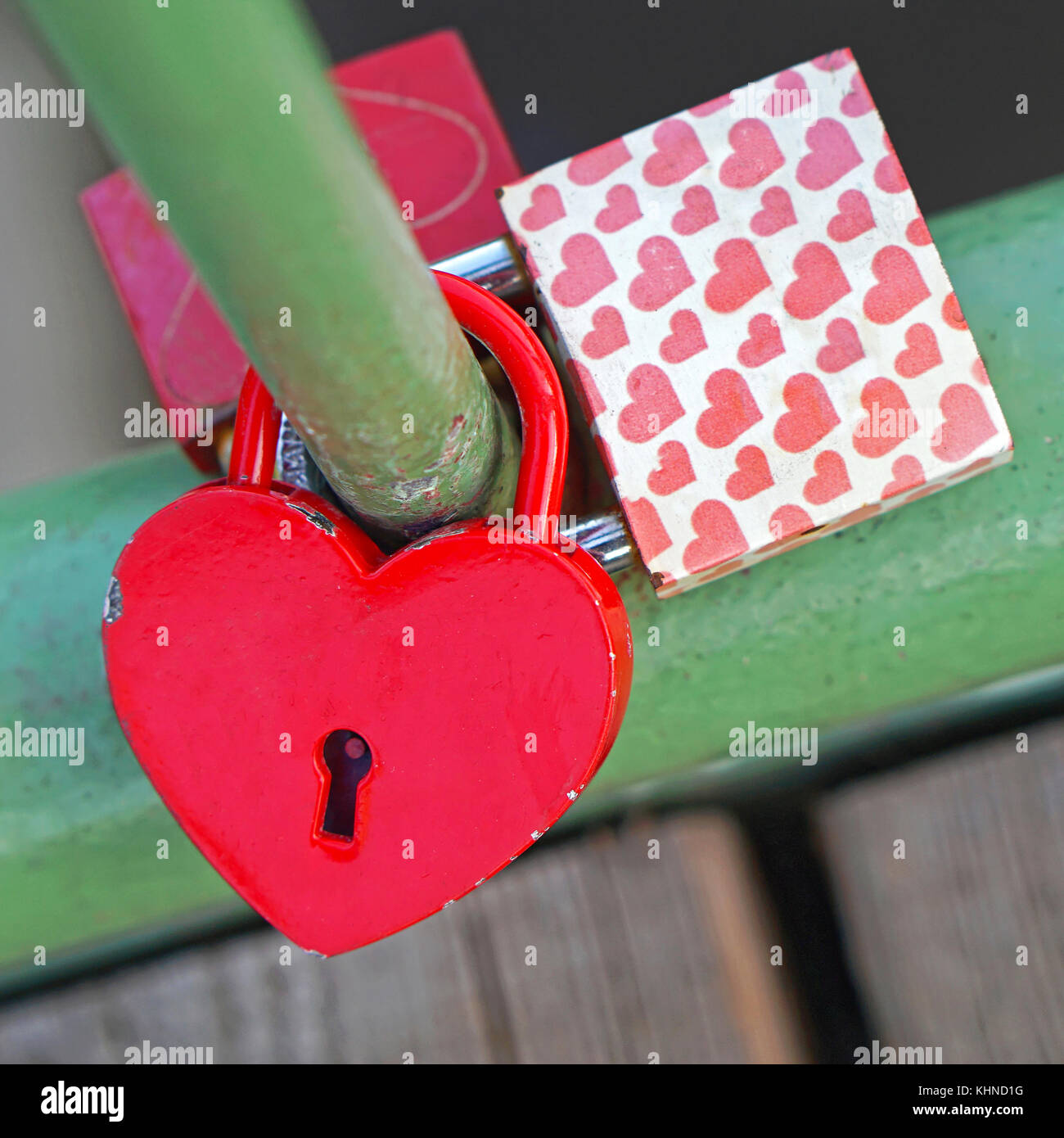 Love locks in shape of heart attached at bridge Stock Photo - Alamy