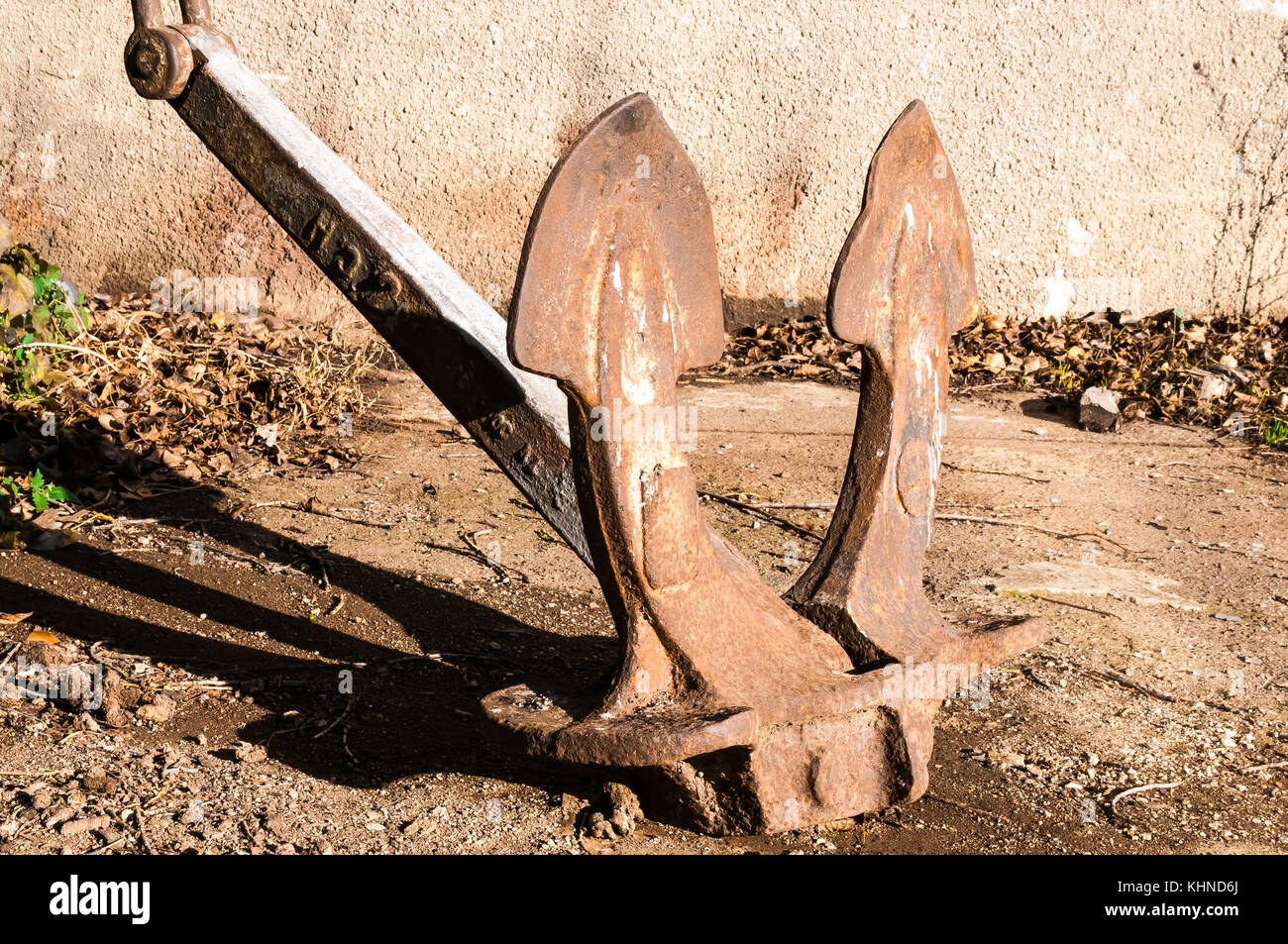 old rusty boat anchor on shore Stock Photo - Alamy