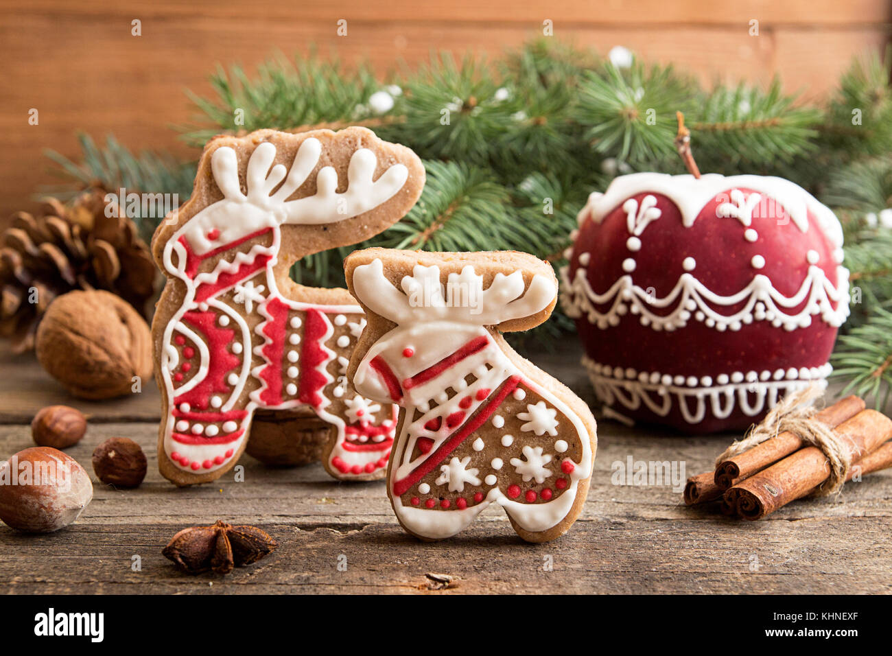 Gingerbread cookies elk and deer, painted apple, fir tree branch ...
