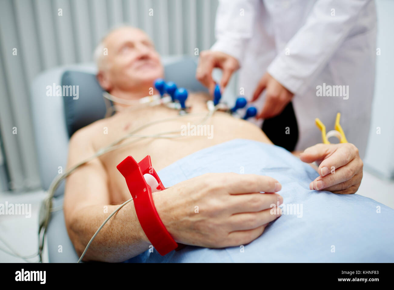 Hands of patient with special equipment around his wrists before having ...