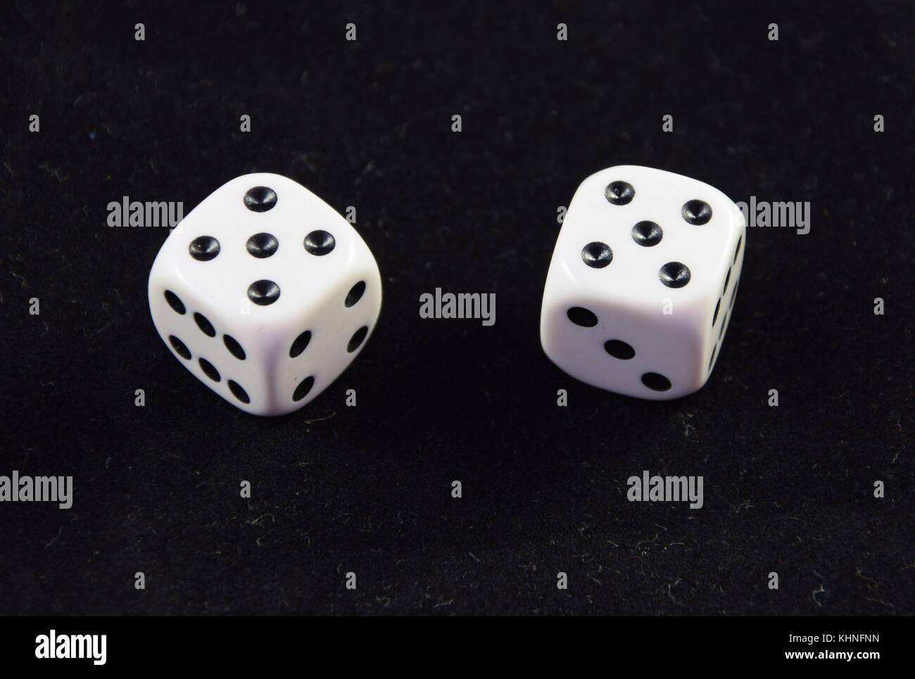 A pair white of dice showing Double Five Stock Photo - Alamy