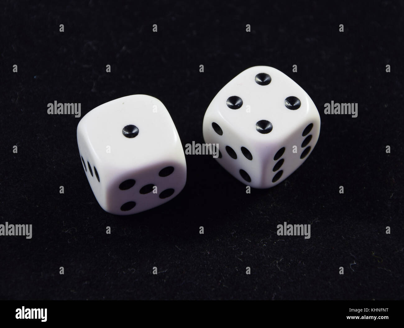A pair white of dice showing Four and One Stock Photo - Alamy