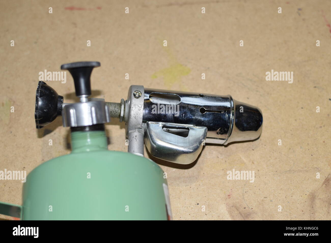 Blowtorch, general view. Blowtorch with a green tank Stock Photo - Alamy