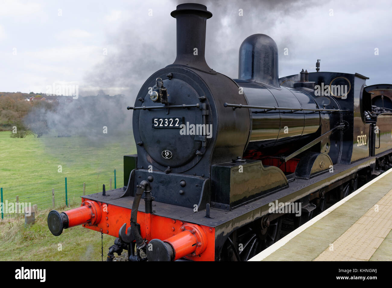 Steam train, black 0 6 0 locomotive waiting to depart from burrs ...