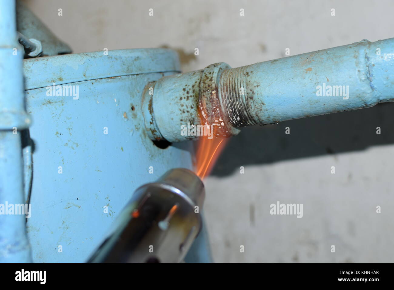 Heating a steel pipe with a blowtorch. The flame of a blowtorch Stock ...