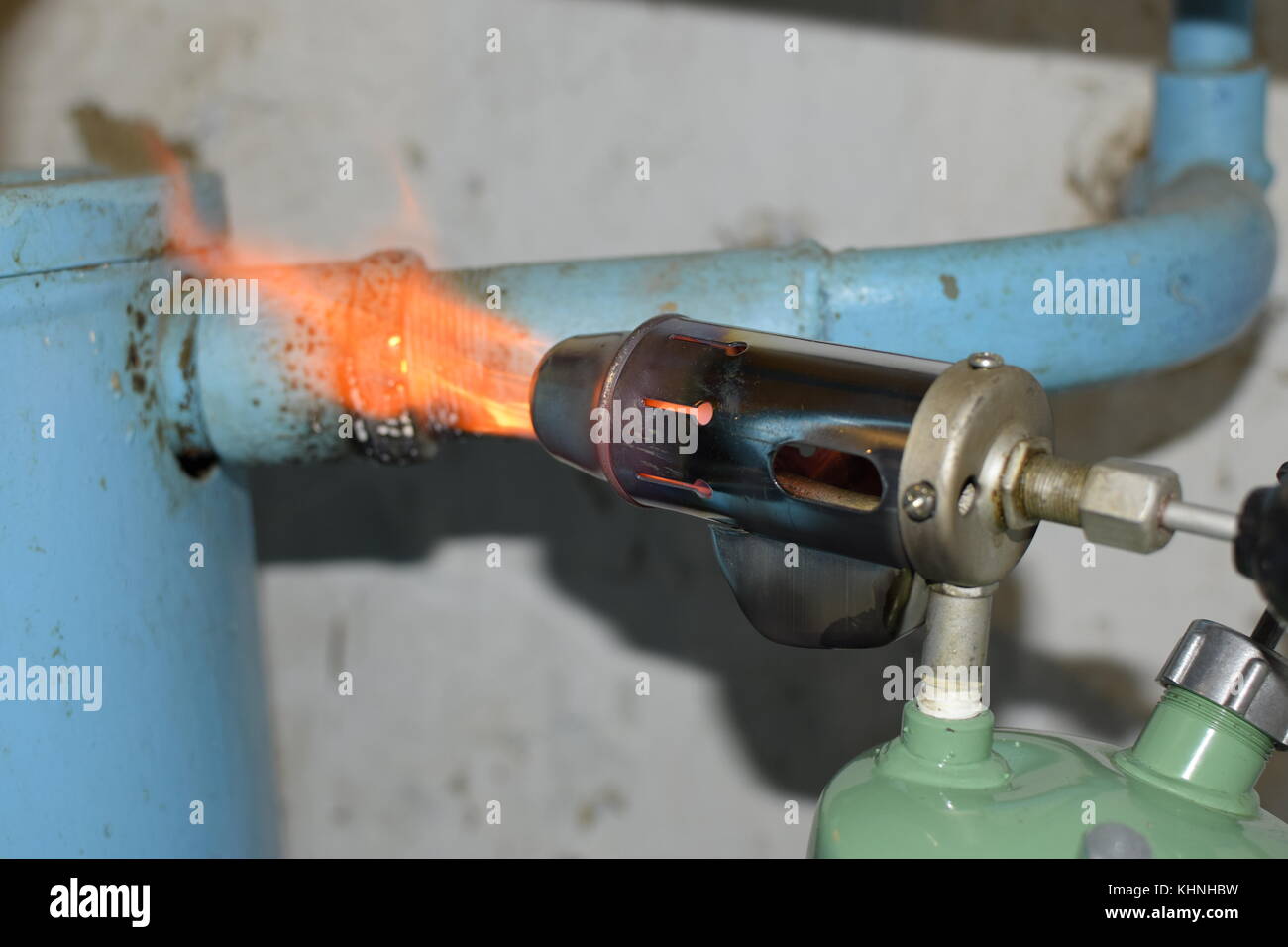 Heating a steel pipe with a blowtorch. The flame of a blowtorch Stock ...