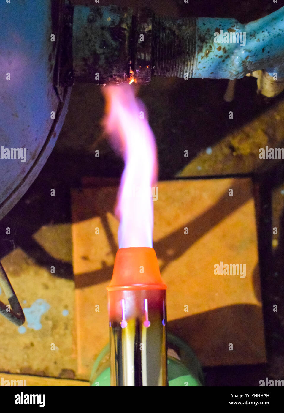 Heating a steel pipe with a blowtorch. The flame of a blowtorch Stock ...