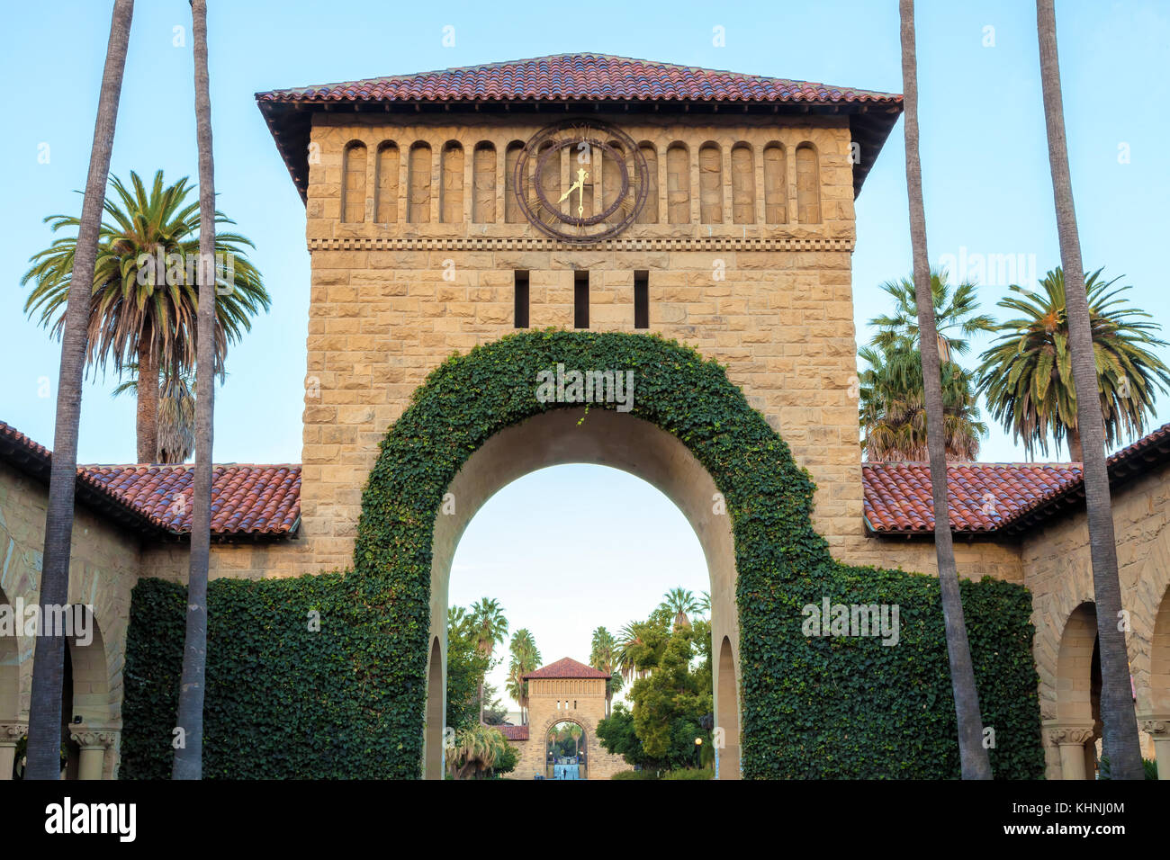 Structures of the arch tower, decorating with the clock and ivy plants ...