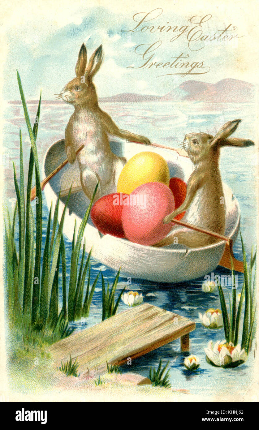 Two Easter bunnies with eggs rowing in a boat made of an eggshell (Zwei ...