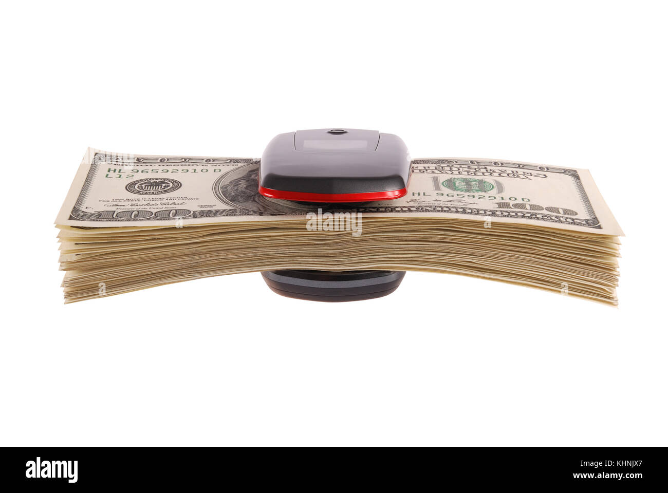 Cell phone and dollars close up. On white background Stock Photo - Alamy