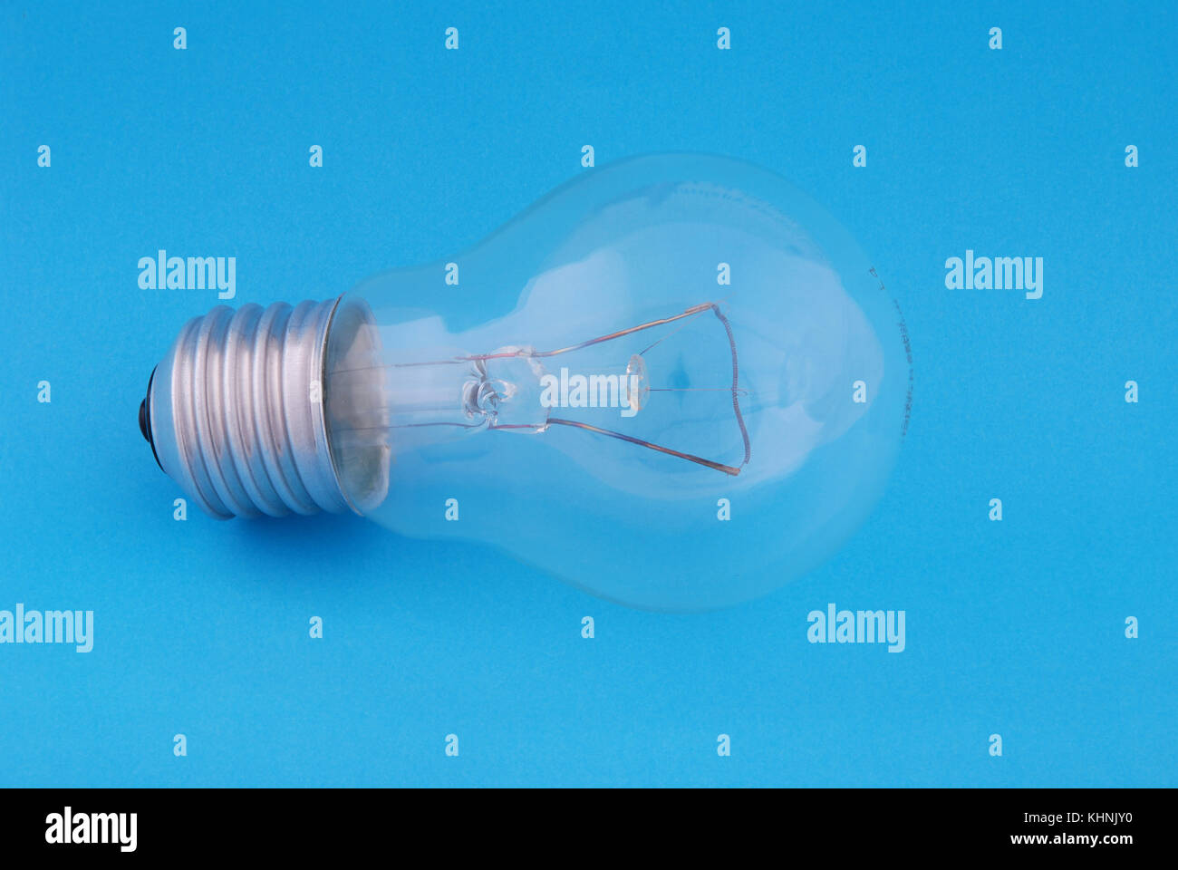 Light bulb on blue background Stock Photo - Alamy