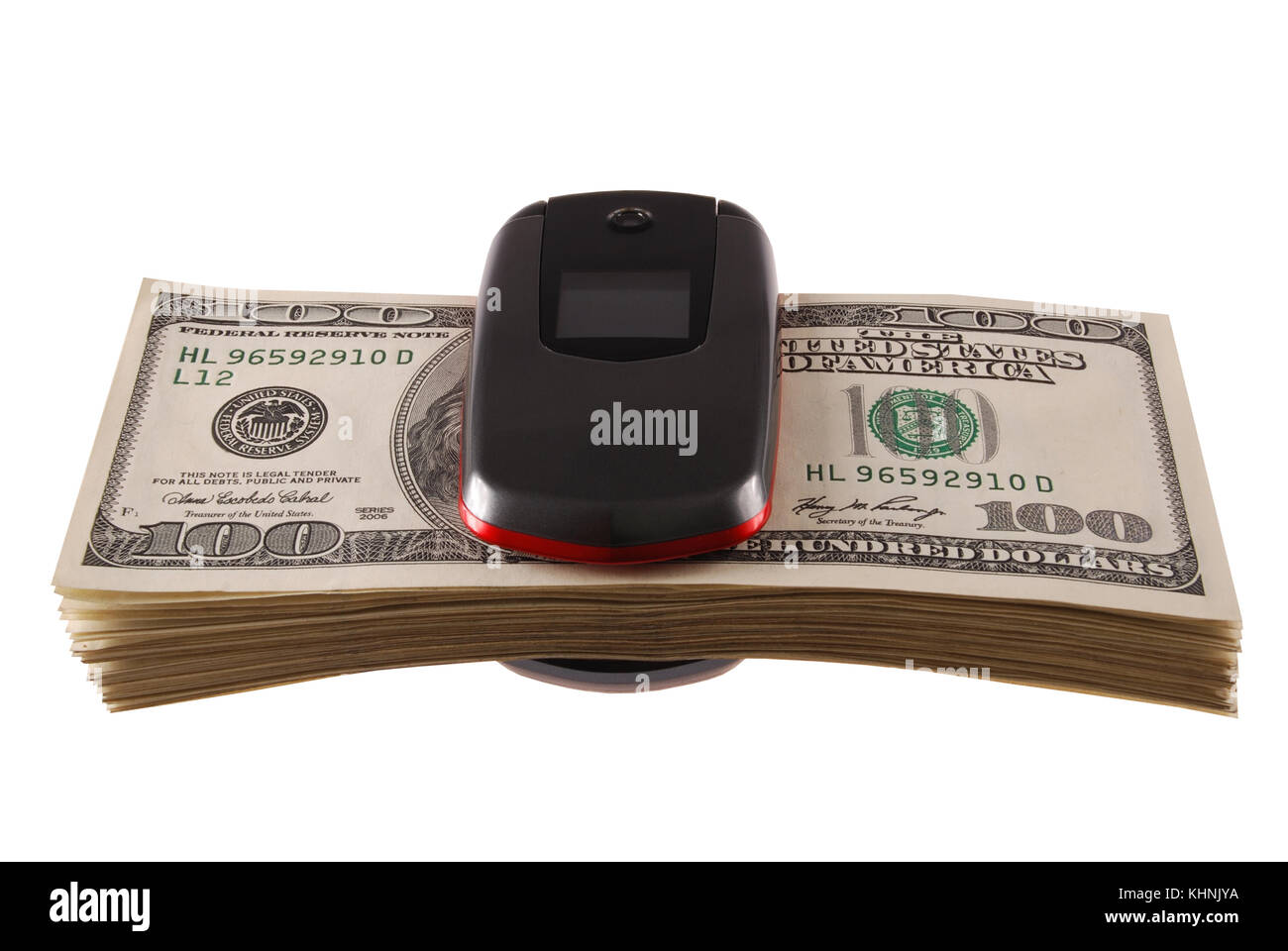 Cell phone and dollars close up. On white background Stock Photo - Alamy