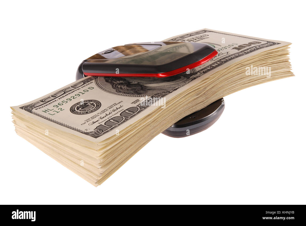 Cell phone and dollars close up. On white background Stock Photo - Alamy
