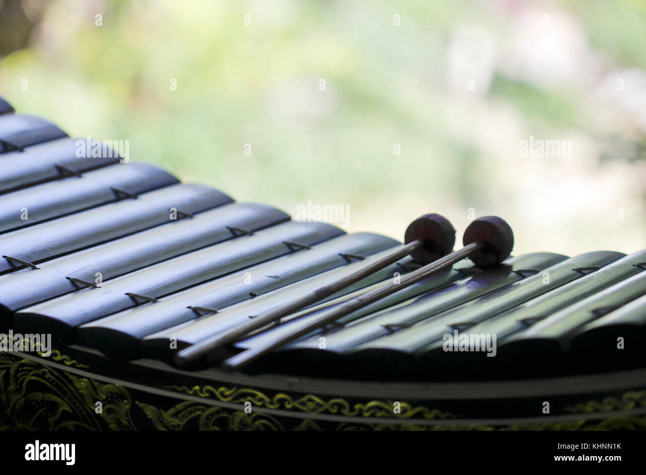 The close up xylophone and two mallets on green background Stock Photo ...