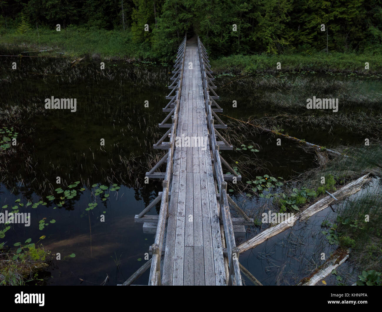 Aerial view of a wooden bridge in Brohm Lake during sunset. Taken ...