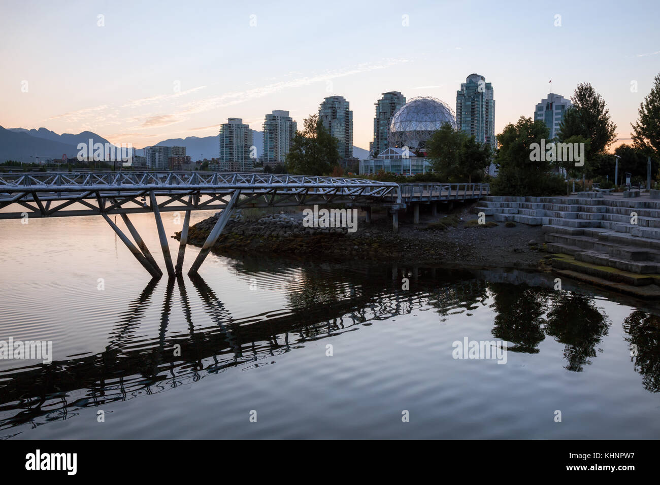 Beautiful view of a steel bridge in False Creek with Vancouver Downtown ...